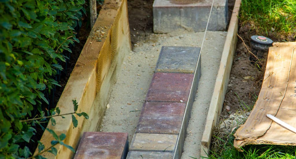 Separate Your Lawn and Garden With Mowing Strips in 7 Easy Steps